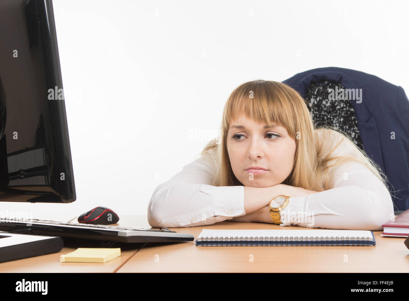 Sad office a specialist looks at a monitor screen Stock Photo - Alamy