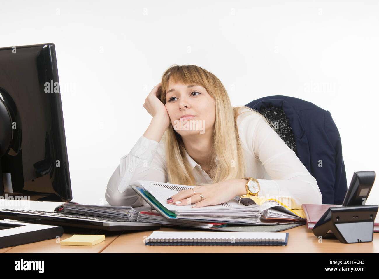 Office work tired a specialist to sort out folders with documents and ...