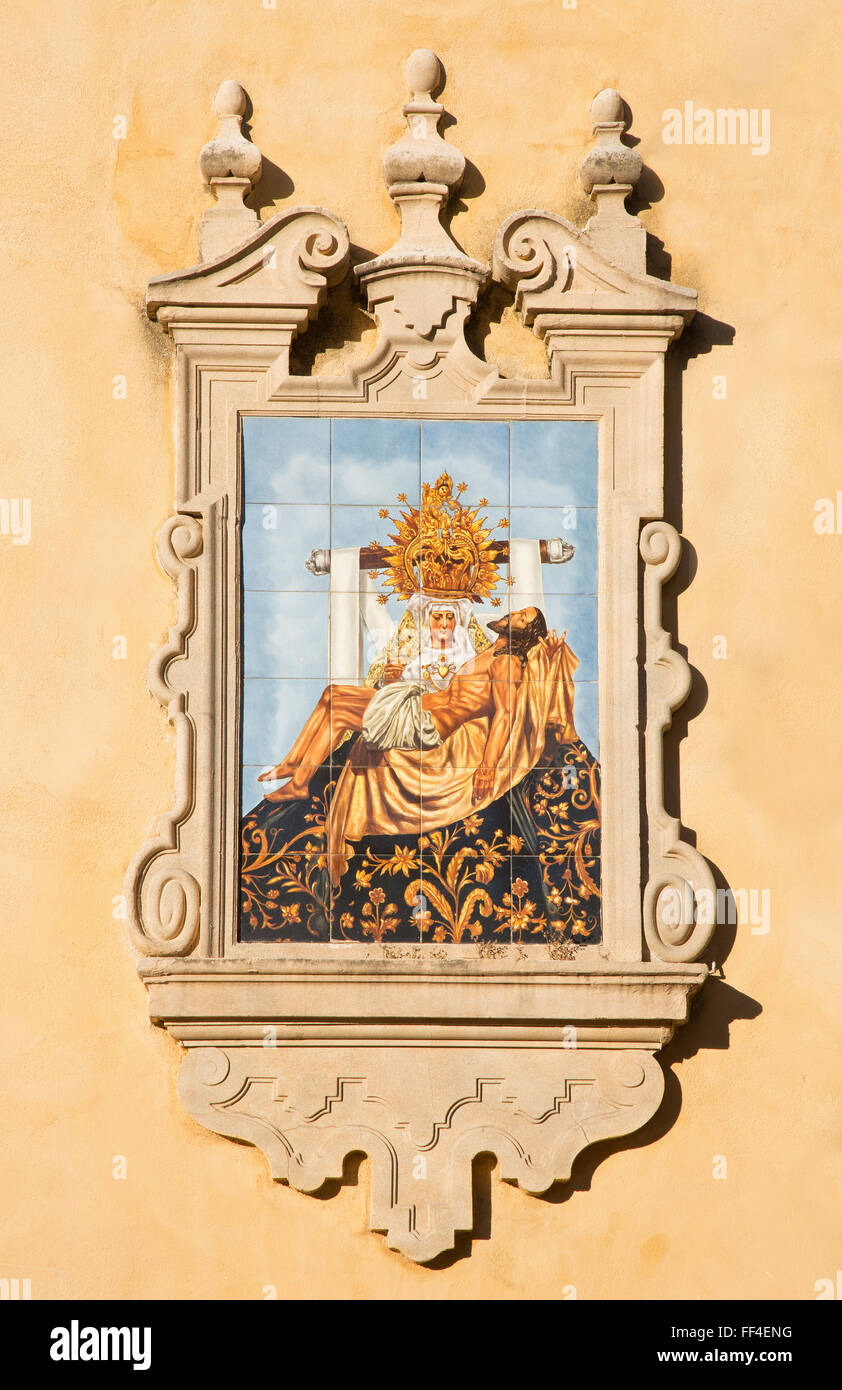CORDOBA, SPAIN - MAY 26, 2015: The ceramic tiled Pieta on the facade of ...