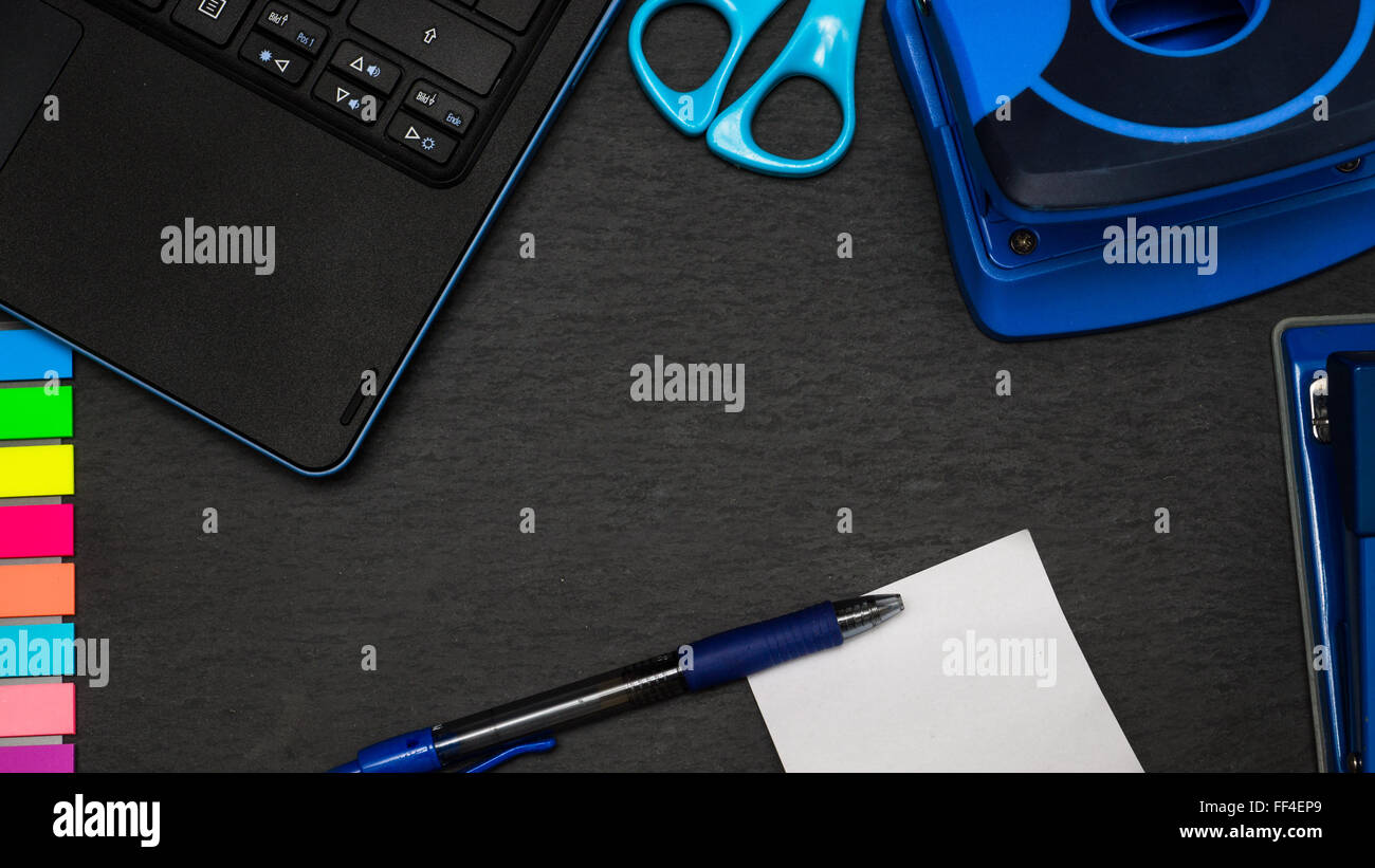 Blue items on an office desk. Space for advertisement´s and notes ...