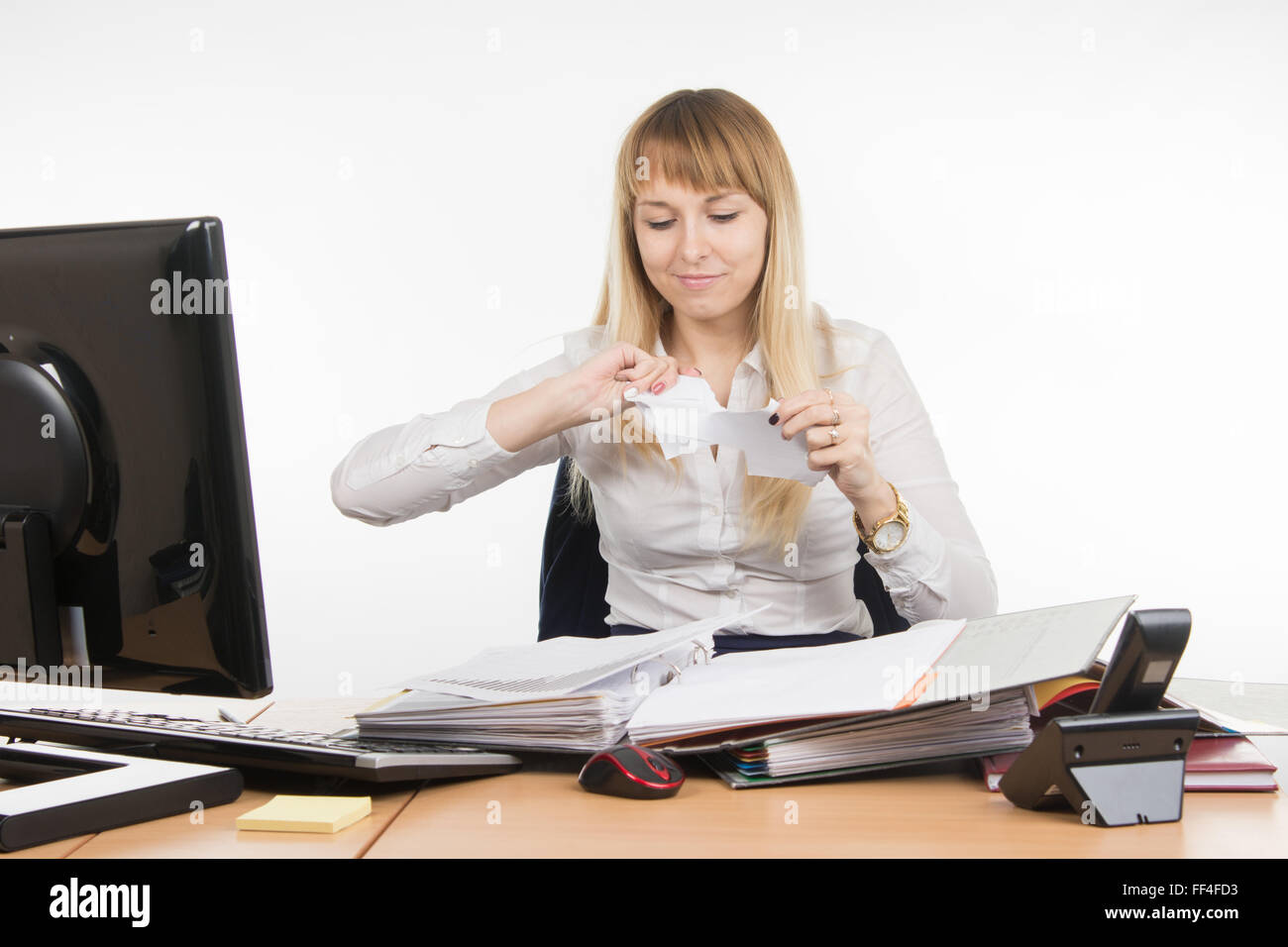 Business woman tearing paper document Stock Photo - Alamy