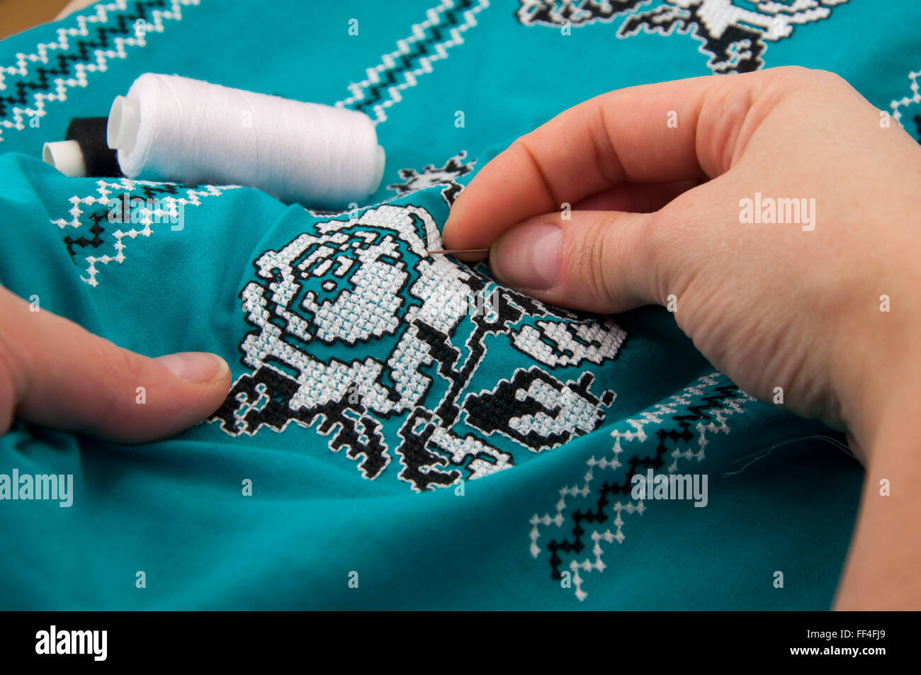 Hand embroidery products from fabric with white and black threads of ...