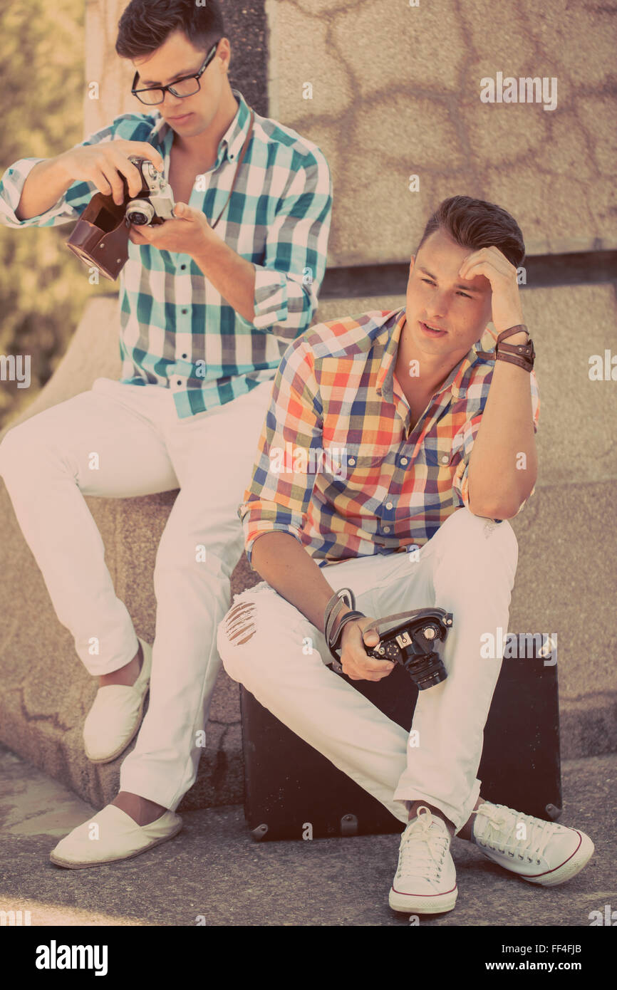 Two guys with vintage retro photo camera outdoor portrait Stock Photo ...
