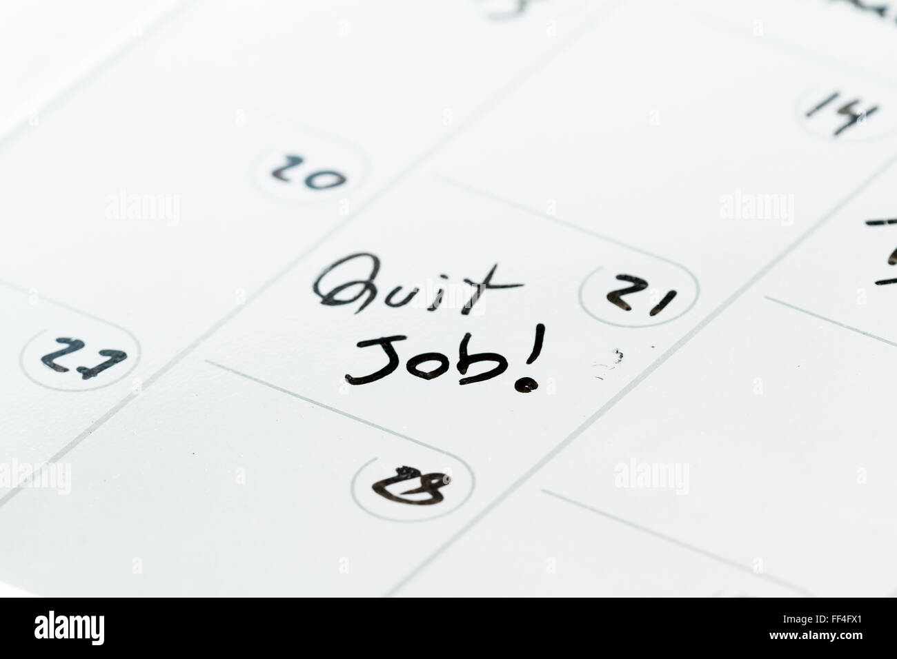 the words quit work hand written on a dry erase calendar as a concept ...