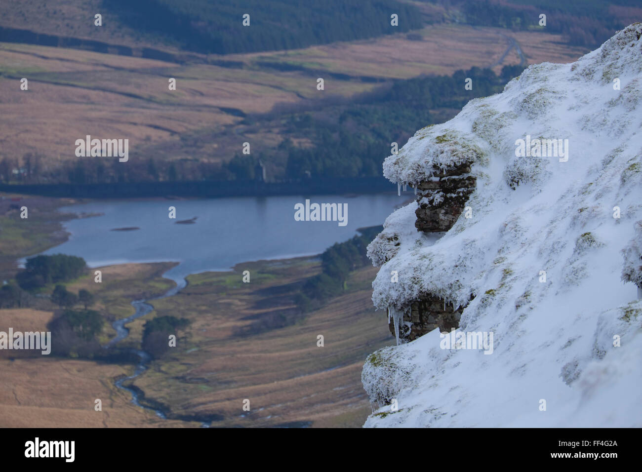 Upper Neuadd Reservoir, view from the snow covered summit of Corn Du ...