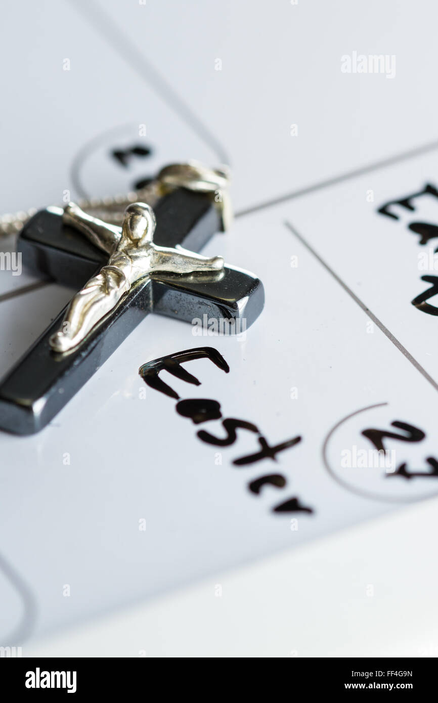 religious cross on a calendar on the date March 27 for a concept for ...