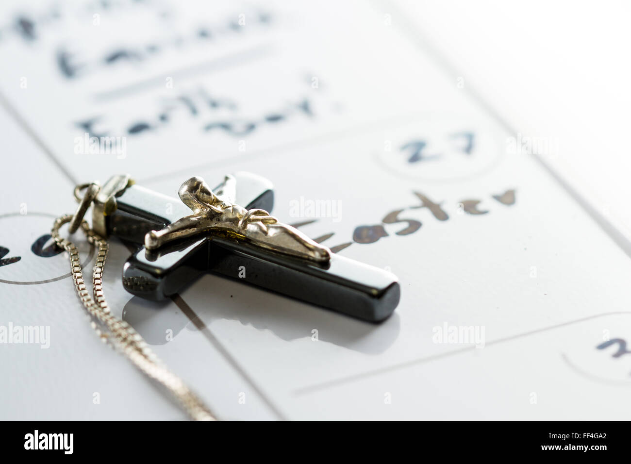 religious cross on a calendar on the date March 27 for a concept for ...