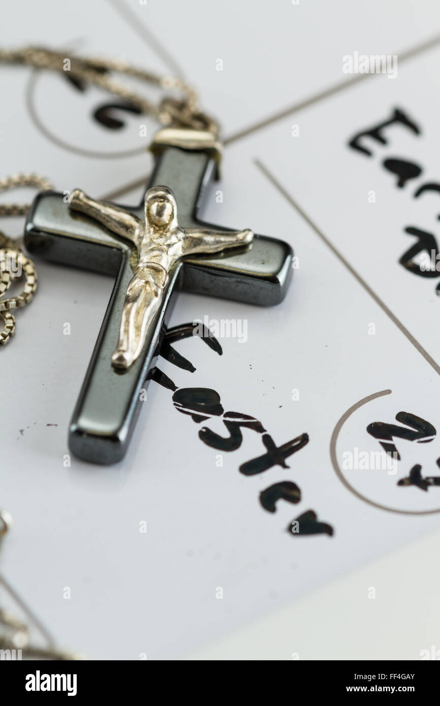 religious cross on a calendar on the date March 27 for a concept for ...