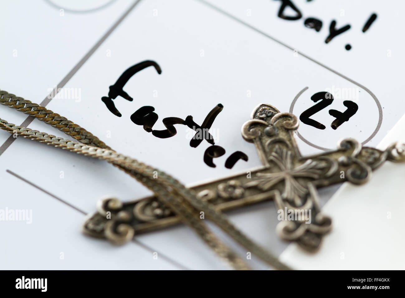 religious cross on a calendar on the date March 27 for a concept for ...