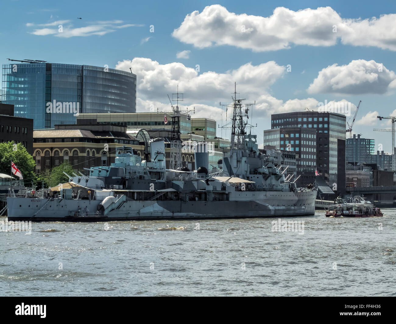 HMS Belfast anchored near Tower Bridge Stock Photo - Alamy