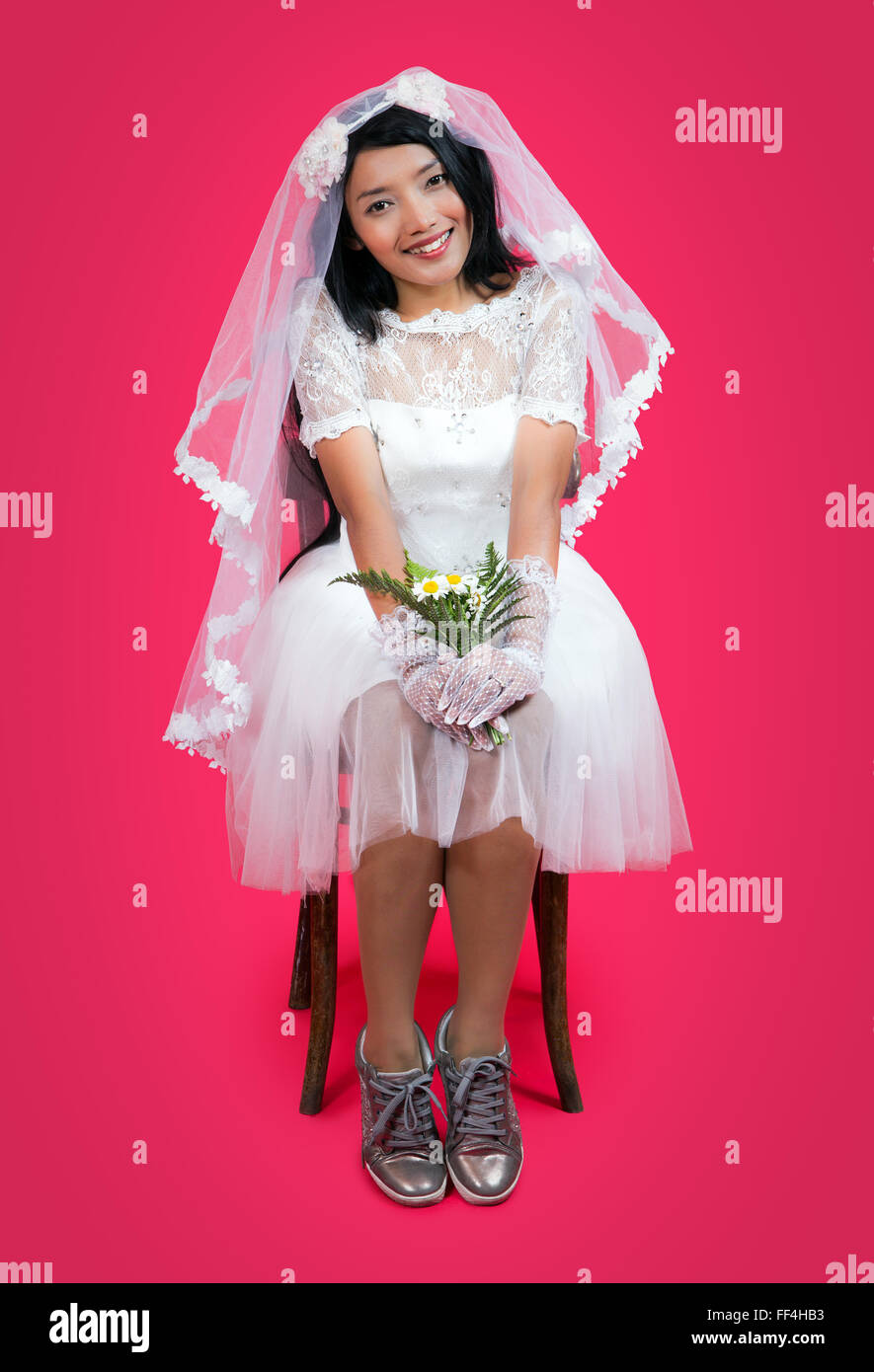 happy bride sitting on a chair Stock Photo - Alamy