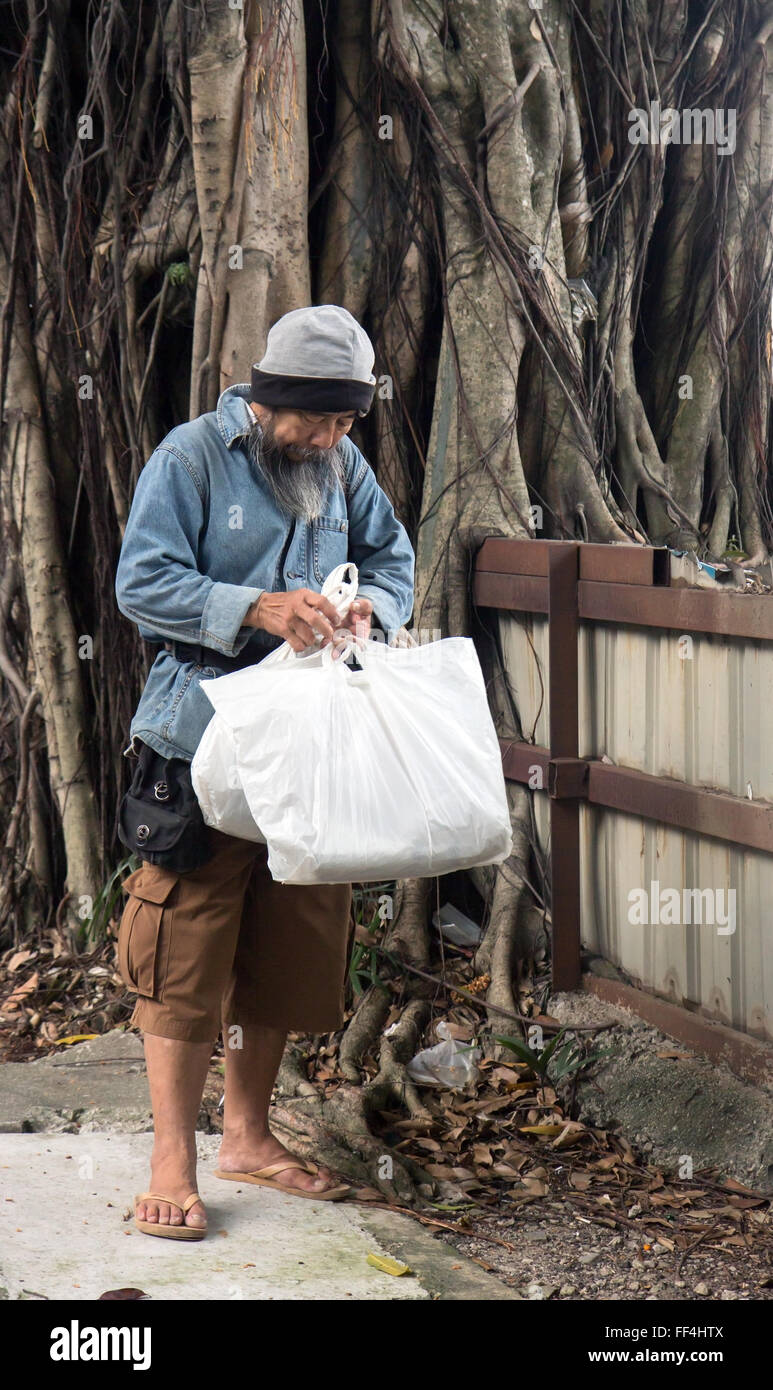 old man with bags on city street Stock Photo - Alamy