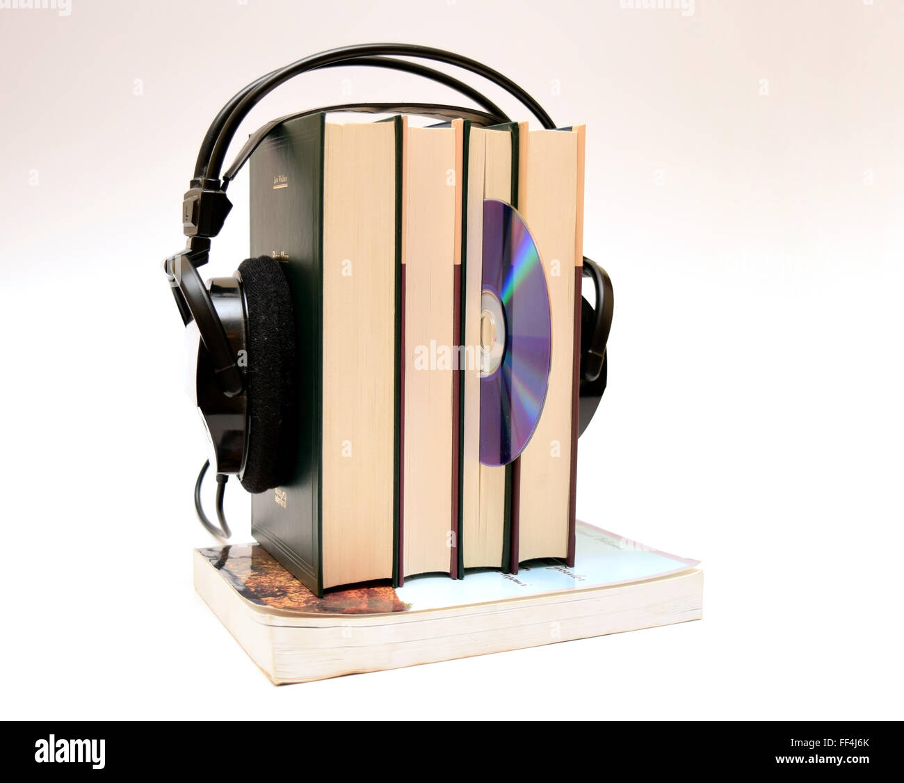audio headphones and loading cd books with white background isolated ...