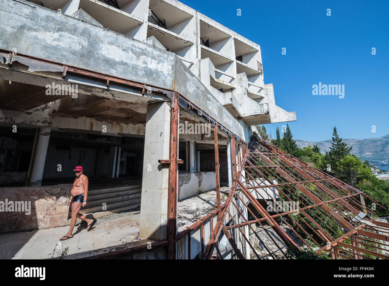 Tourist in abandoned Goricina Hotel in Kupari, tourist complex ...