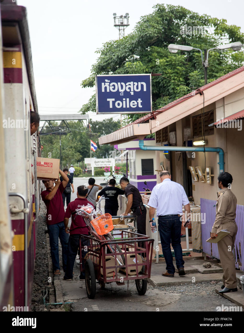 men at the station loaded packages into the train Stock Photo - Alamy