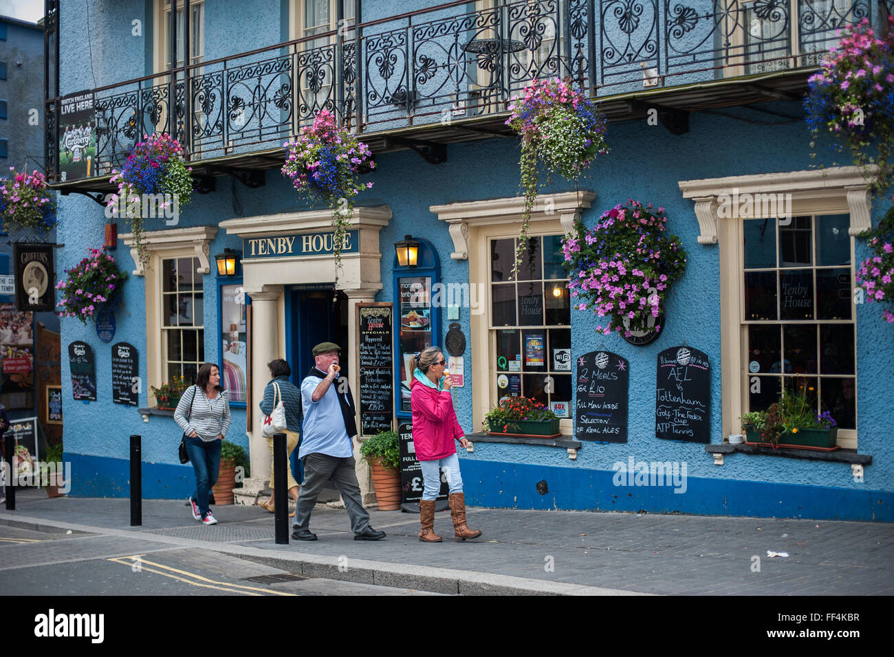 Tourists in front of Tenby House Hotel, Tenby, Wales Stock Photo - Alamy