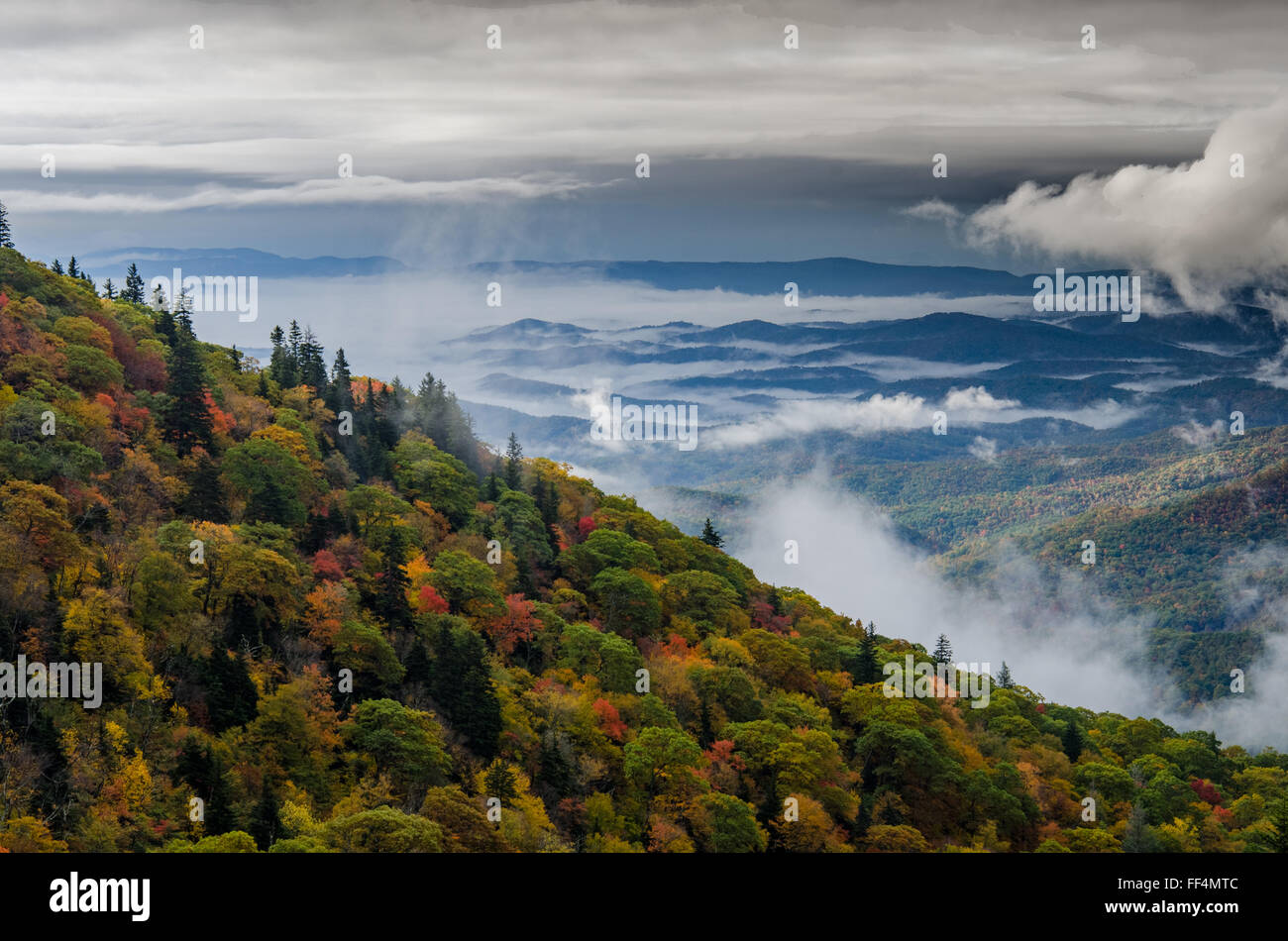 Fall view of early morning clouds between mountain ridges along the ...