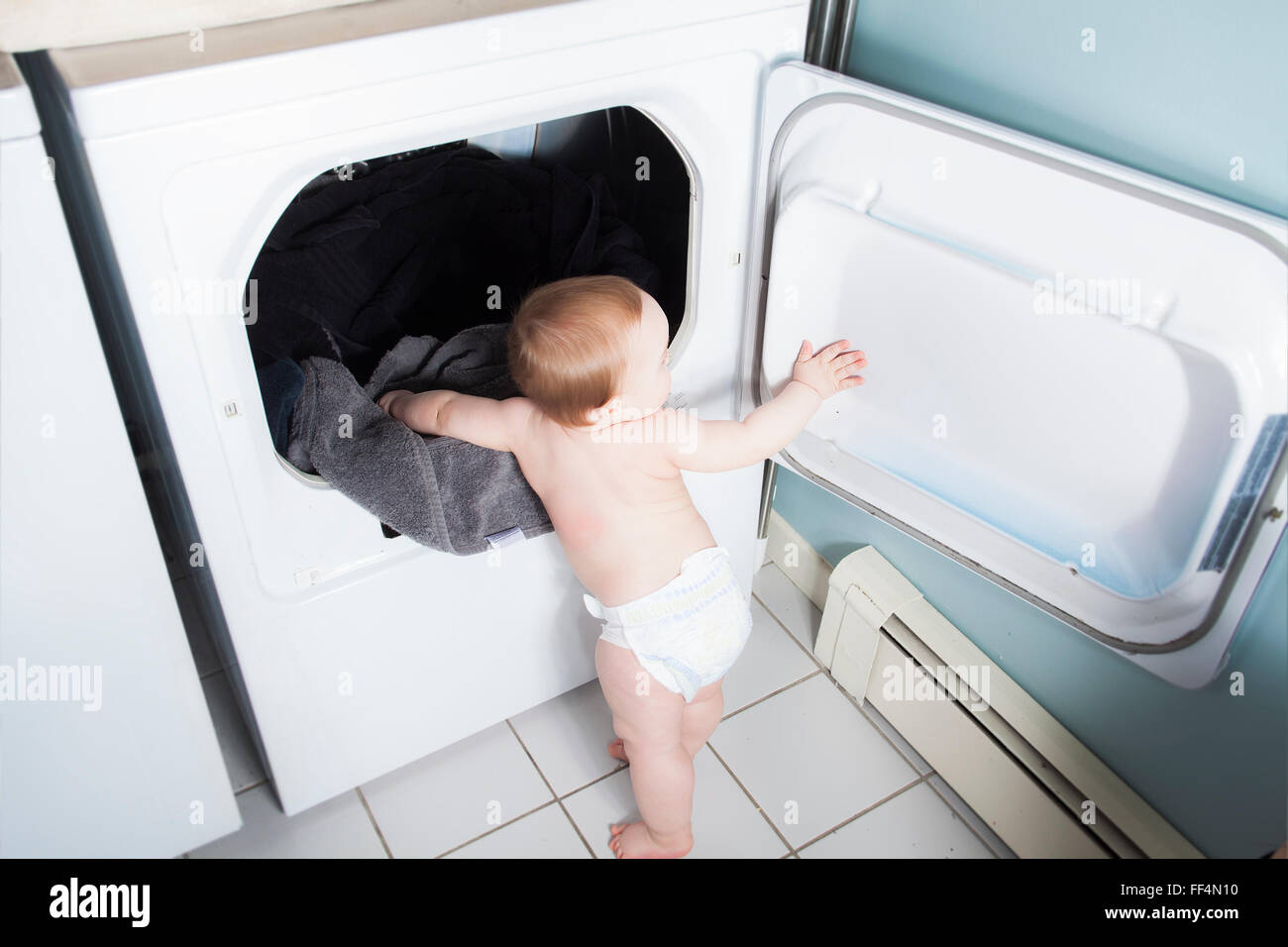 Child girl washing machine hi-res stock photography and images - Alamy