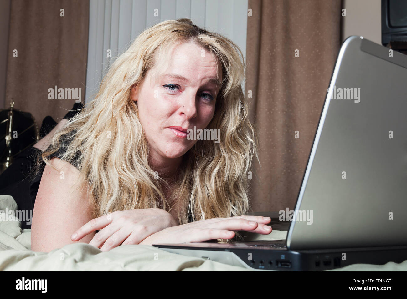 A woman inside is bedroom feel depress Stock Photo - Alamy