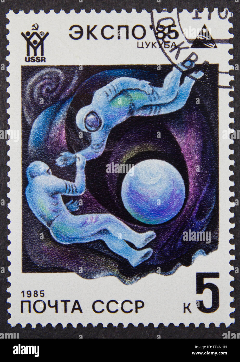 A stamp printed in Russia, shows Cosmonauts in space in EXPO ’85 ...