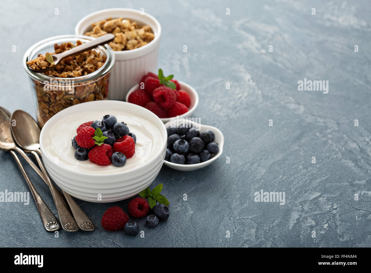 Natural yogurt in a bowl with berries Stock Photo - Alamy