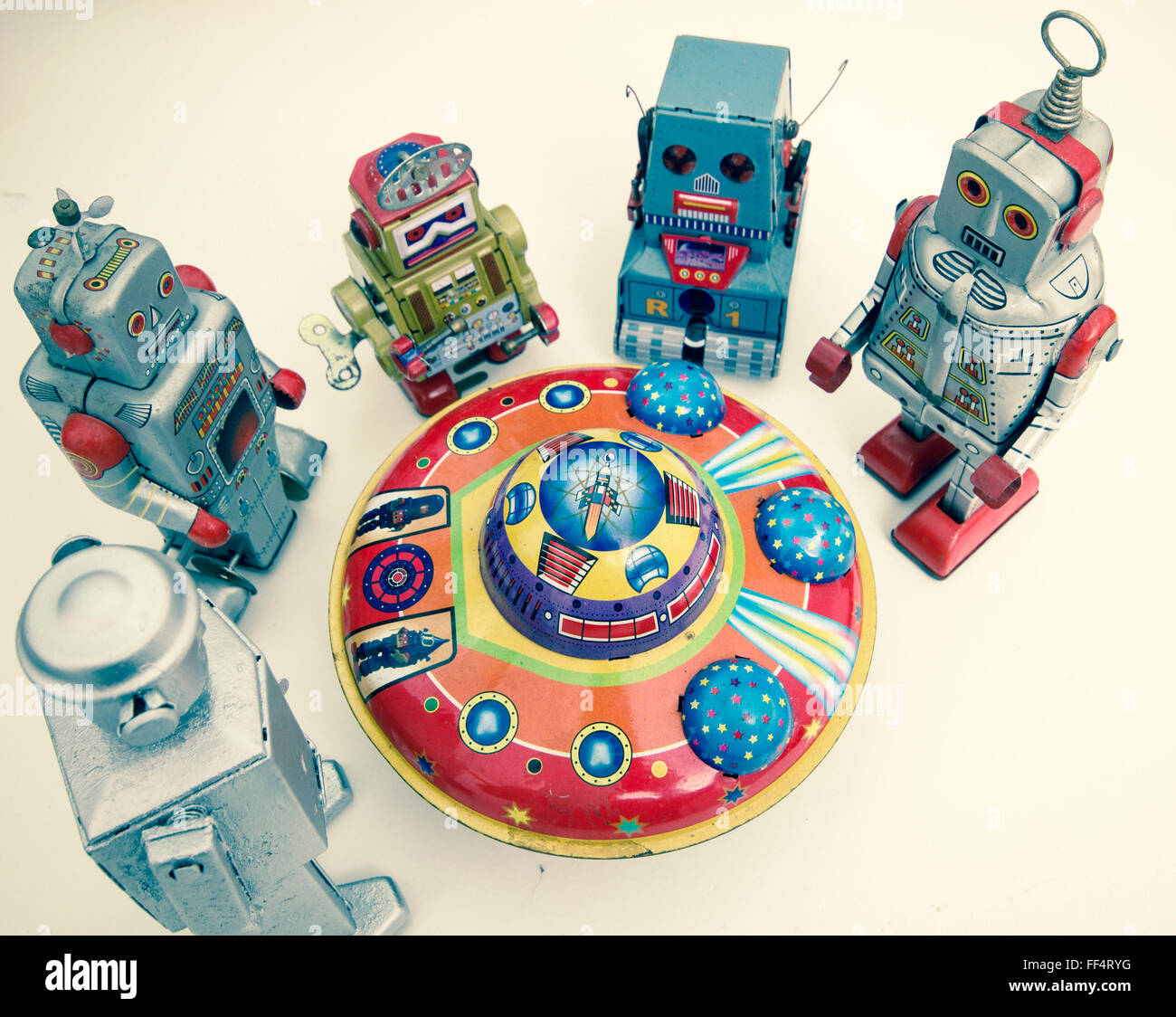 robots gather round a old UFO Stock Photo - Alamy