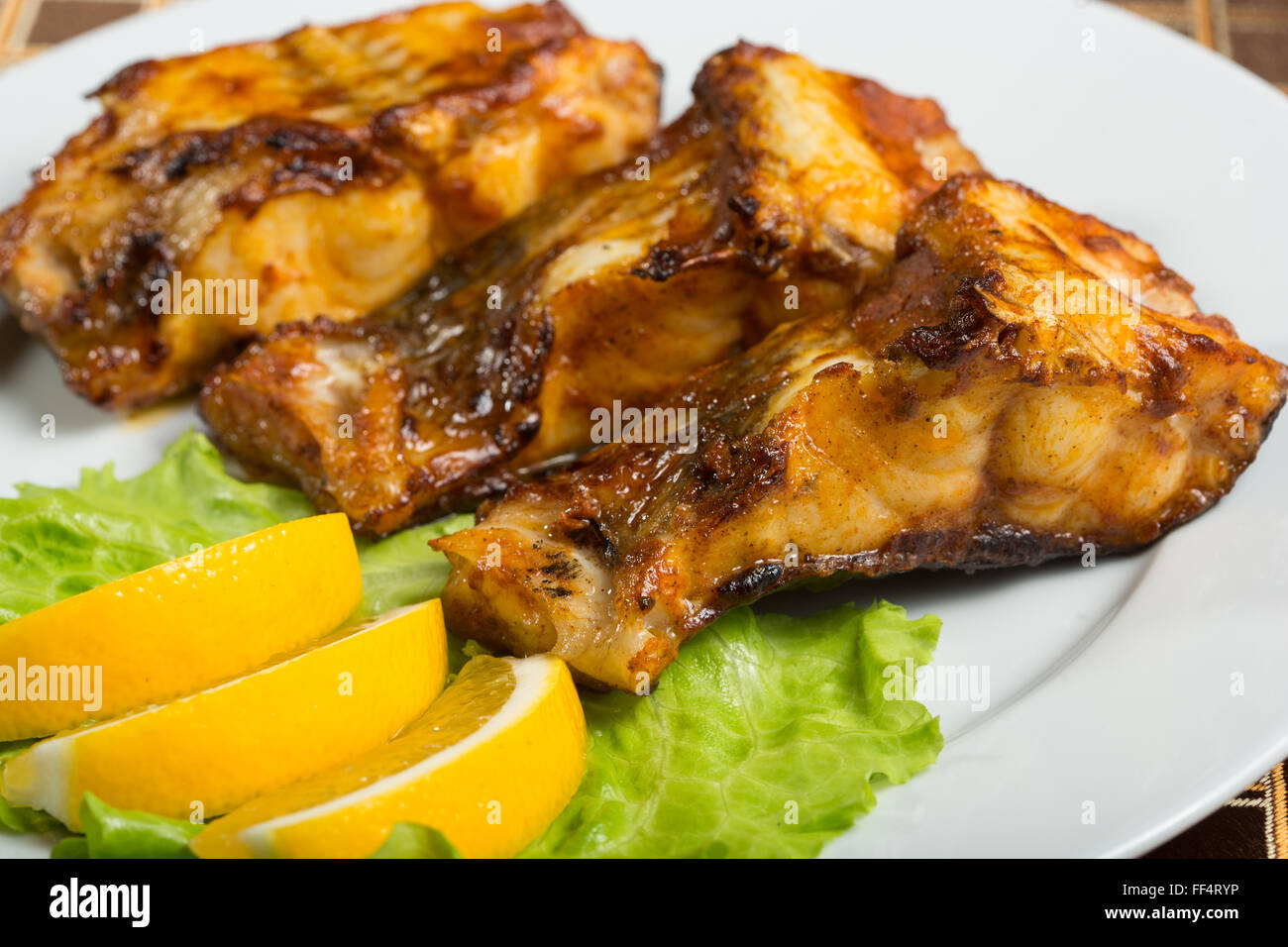 fried catfish. delicious fatty fish on a plate Stock Photo - Alamy