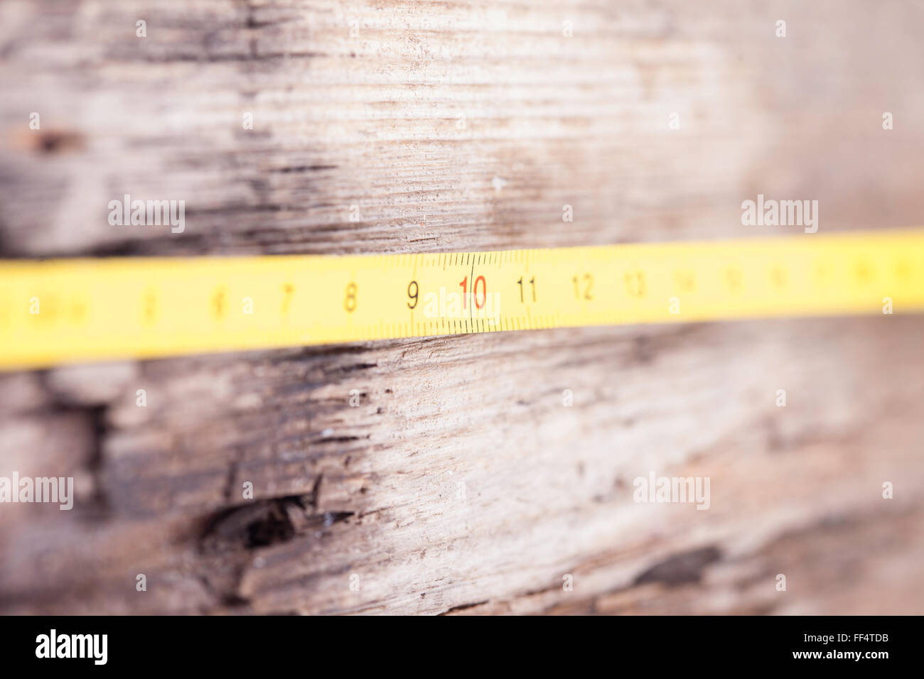 ruler grunge wood surface. focus on the number 10 Stock Photo - Alamy