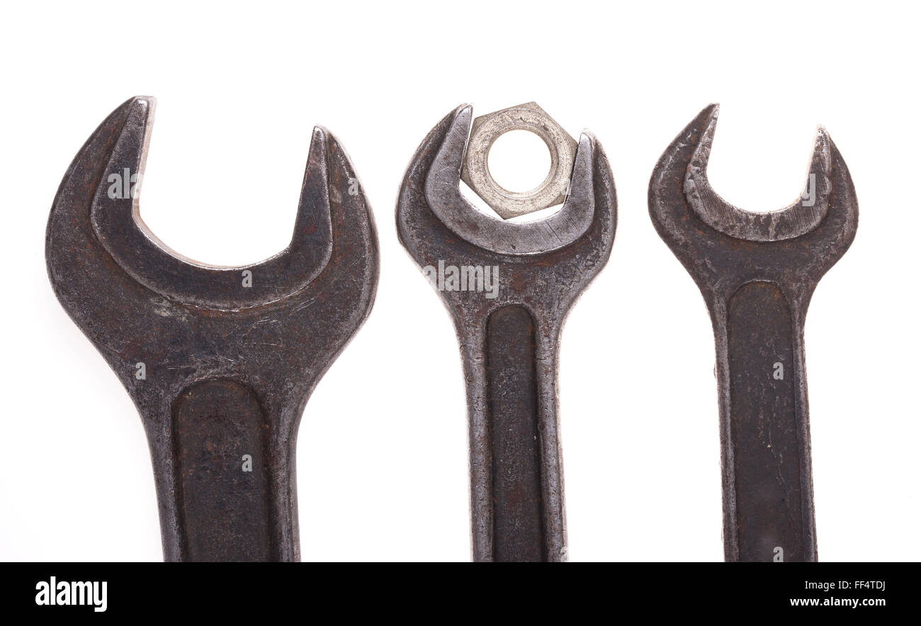 old wrenches and nut closeup isolated on white background Stock Photo ...
