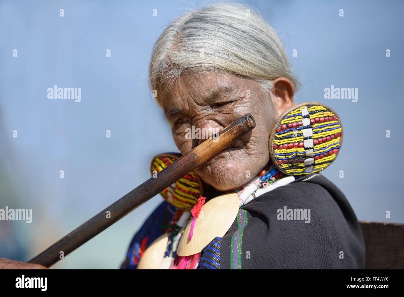 Yaw Shen, a Magan Chin woman with face tattoos, plays traditional nose ...
