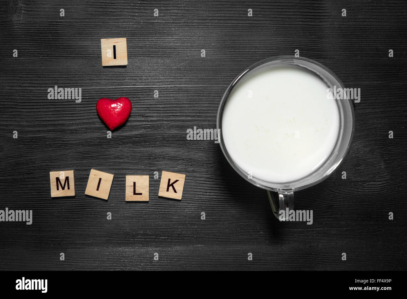I love milk concept on black wooden background Stock Photo - Alamy