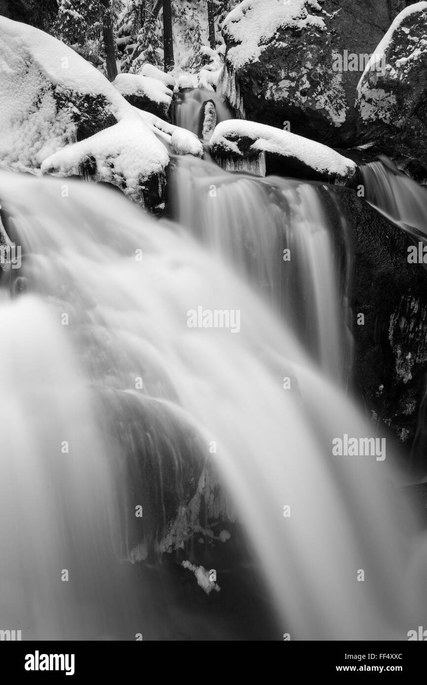 waterfall in snow, frozen waterfall, snowy cold water of north river ...