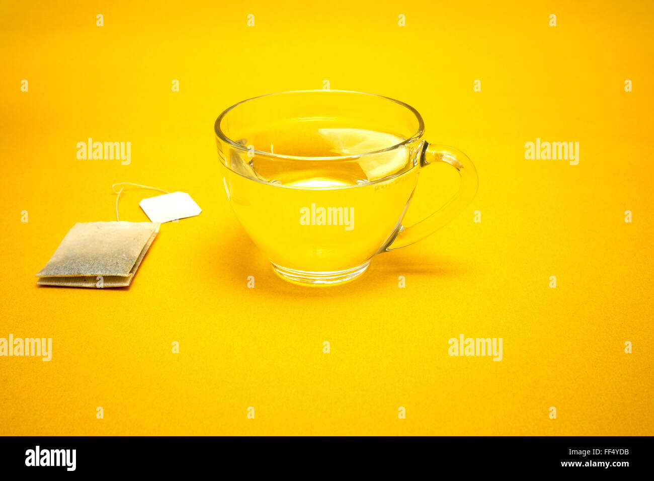 Cup of tea on a yellow background Stock Photo - Alamy
