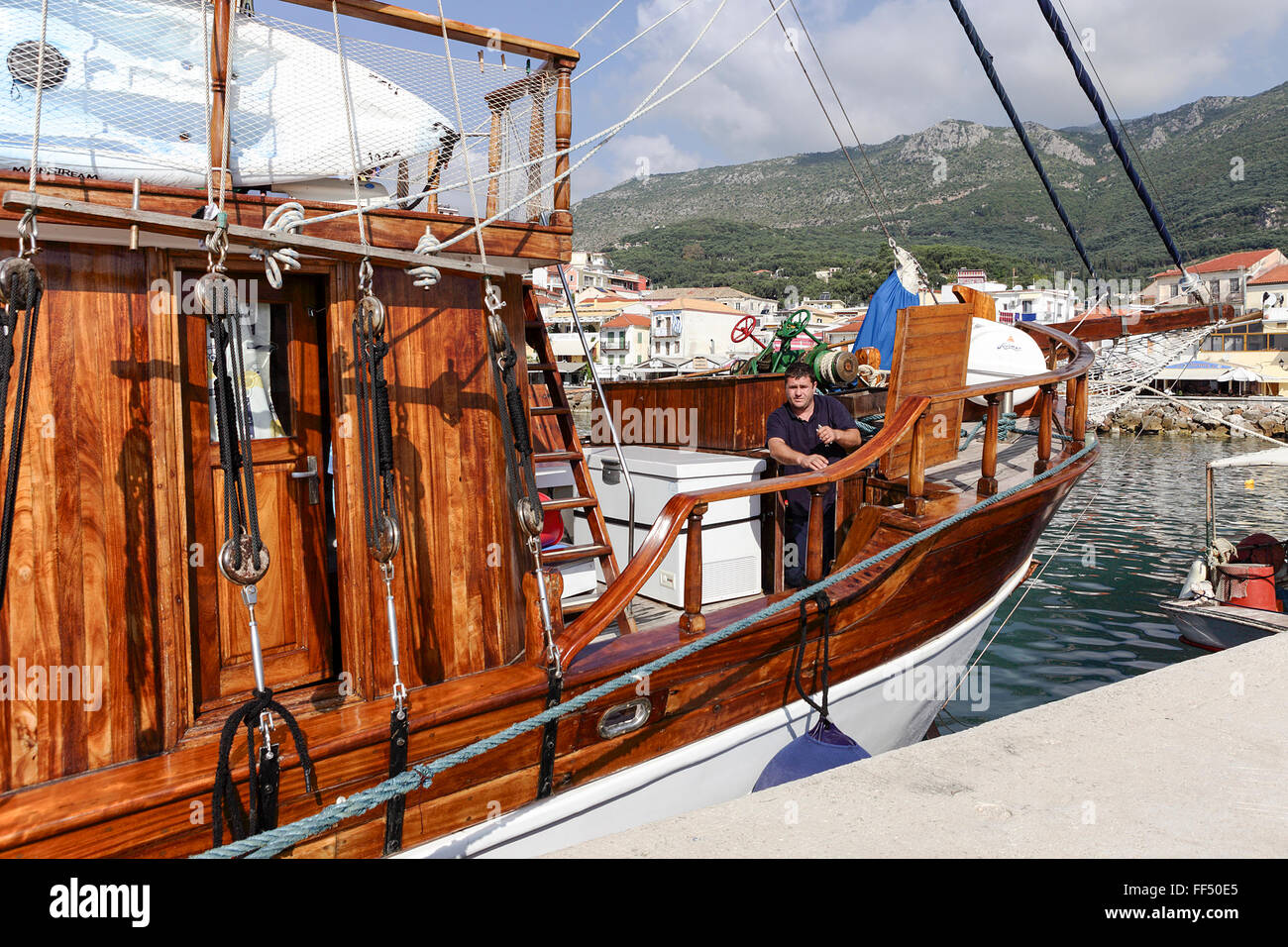 Situated on Parga Town jetty, local ferry/leisure craft await their ...