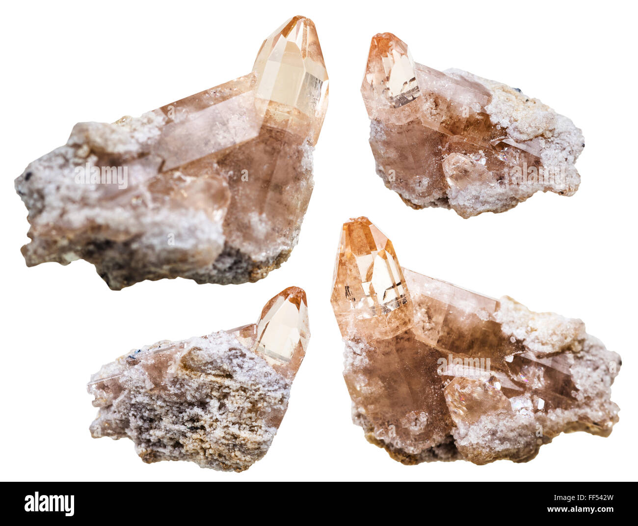 macro shooting of natural mineral stone - four topaz crystals on rocks ...