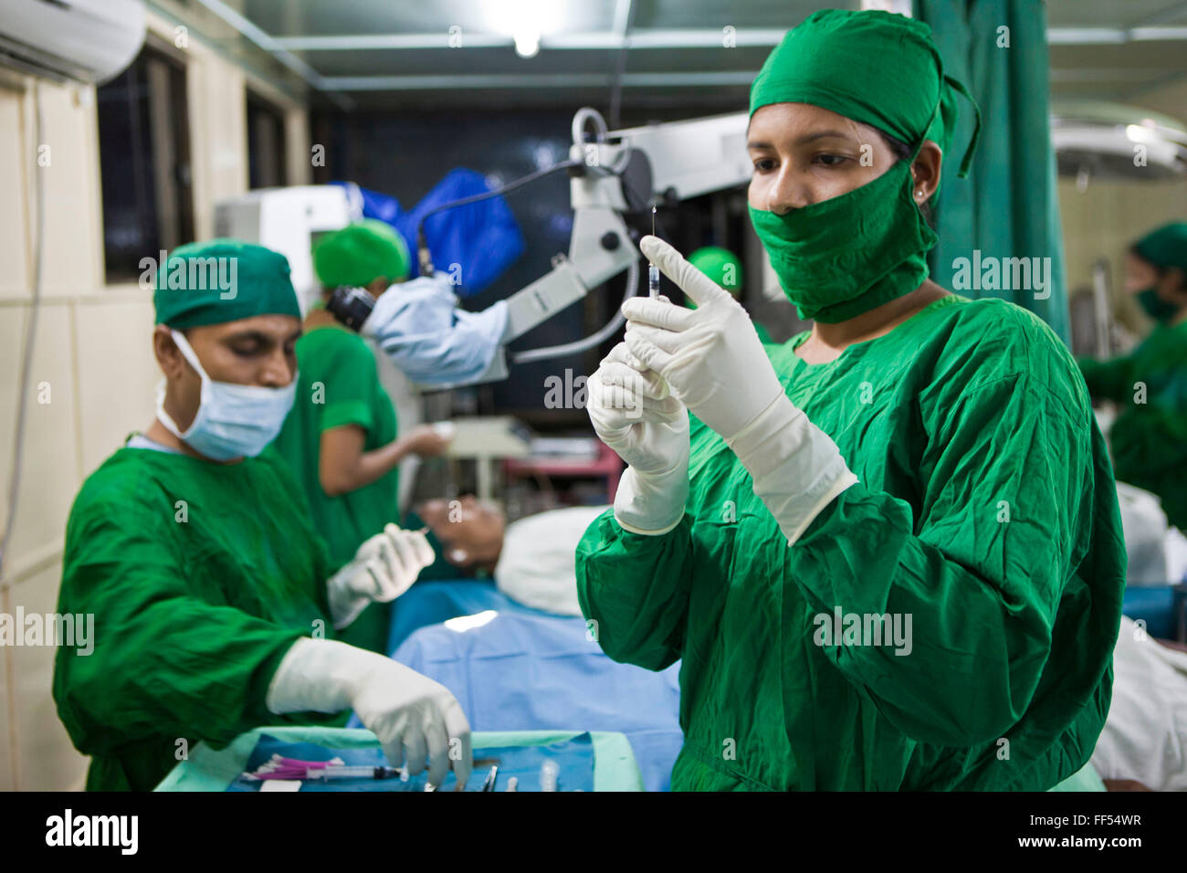 A nurse prepares a needle for Dr Mohamed Shaheen to perform Cataracts ...