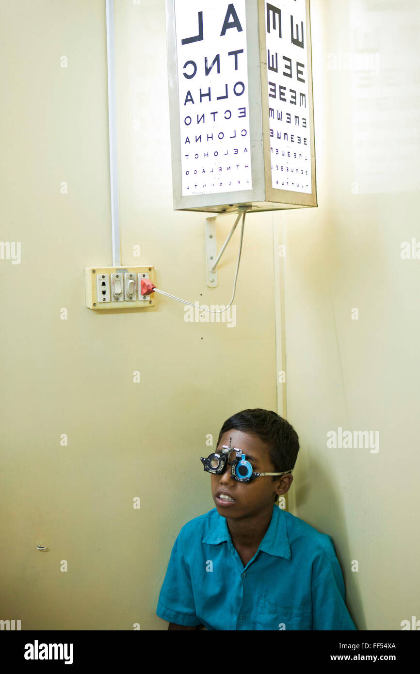 A young boy receives an eye examination from Dr Mohamed Shaheen on the ...