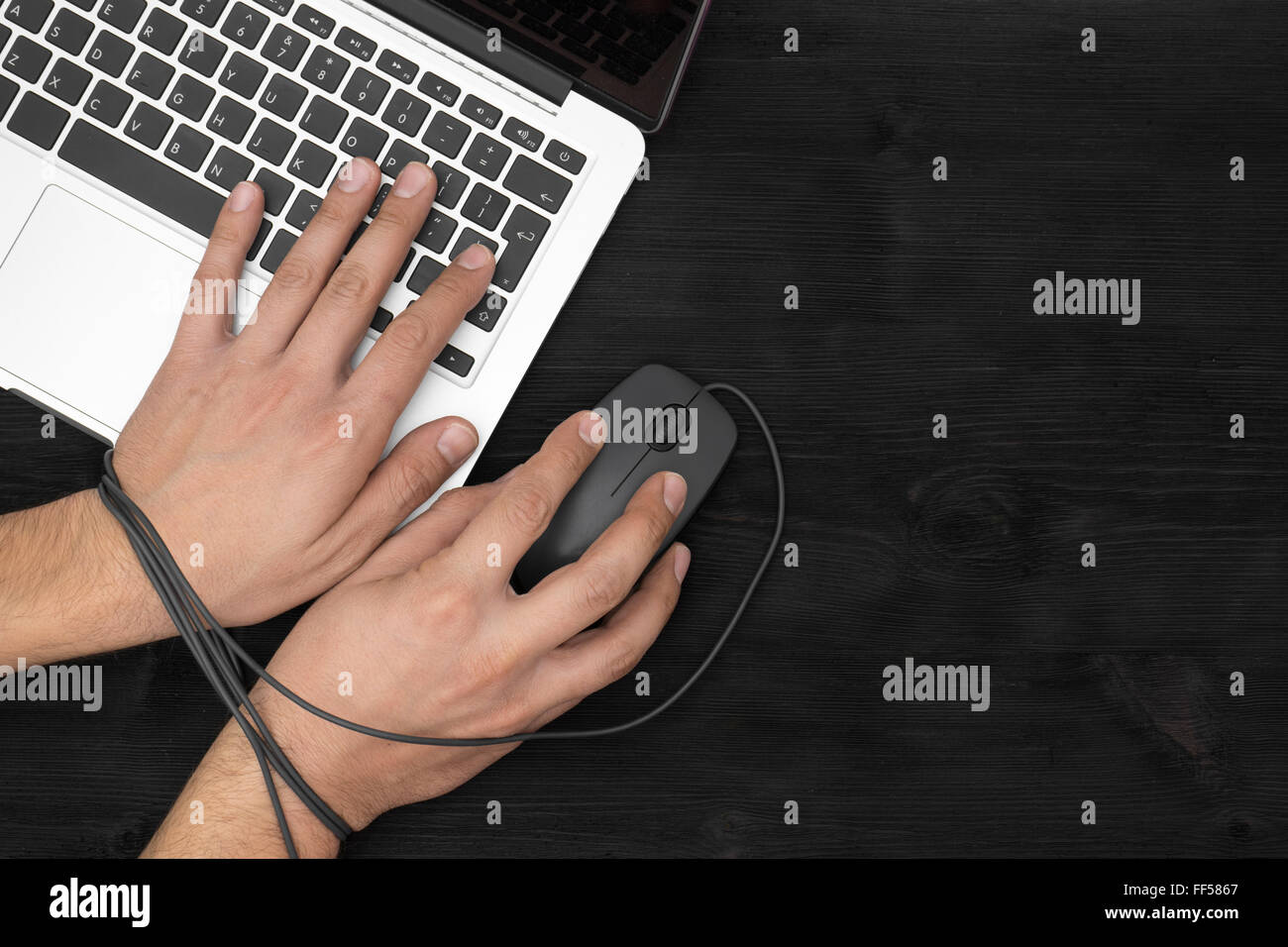 Hands of man addicted to computer, internet slave and addict concept ...