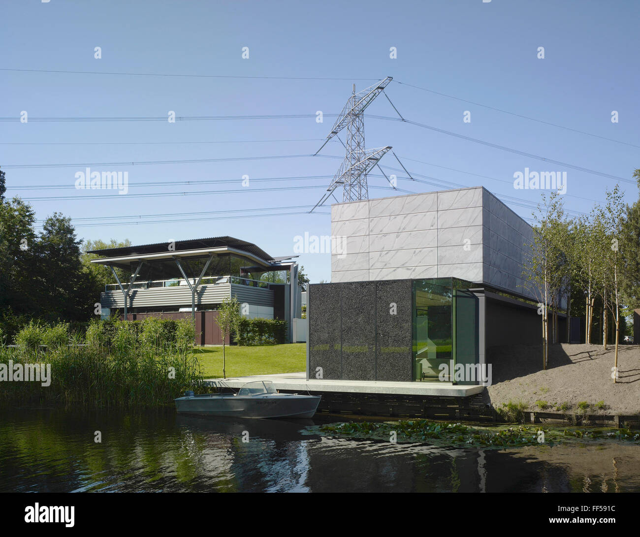 View across canal towards private home and office. Project X, Almere ...
