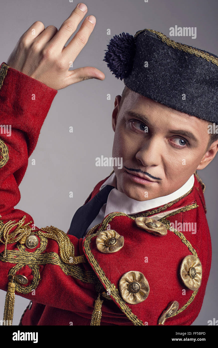 Studio shot of man dressed as Spanish torero, matador, bullfighter ...