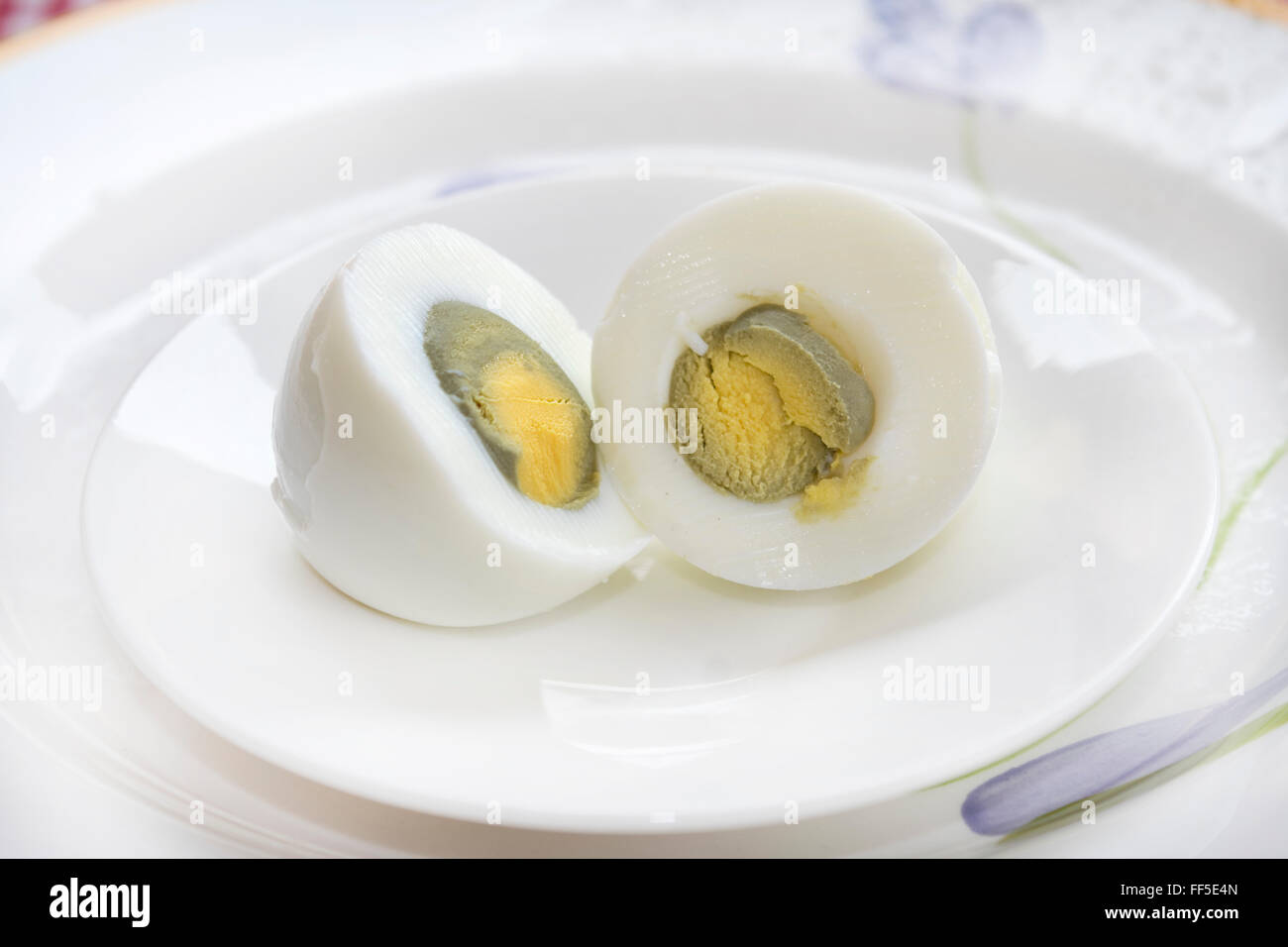 hard-boiled eggs cut half on the white dish Stock Photo - Alamy