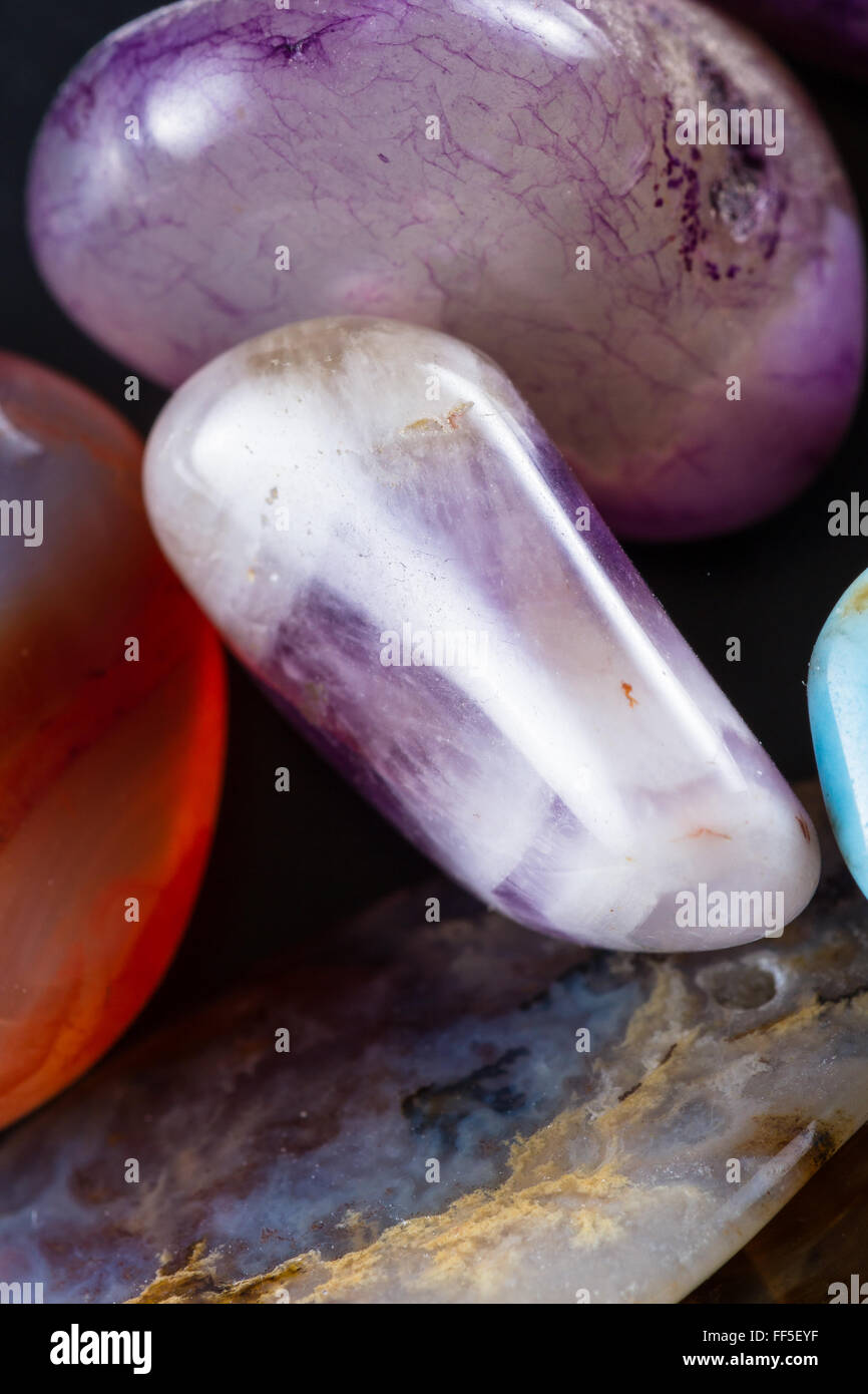 close up of a pile of polished stones in multiple colors and shapes ...