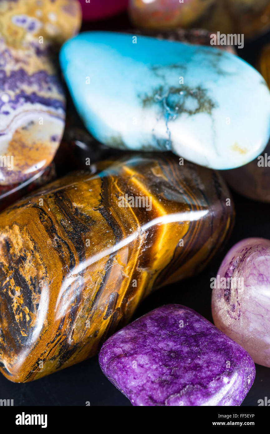 close up of a pile of polished stones in multiple colors and shapes ...