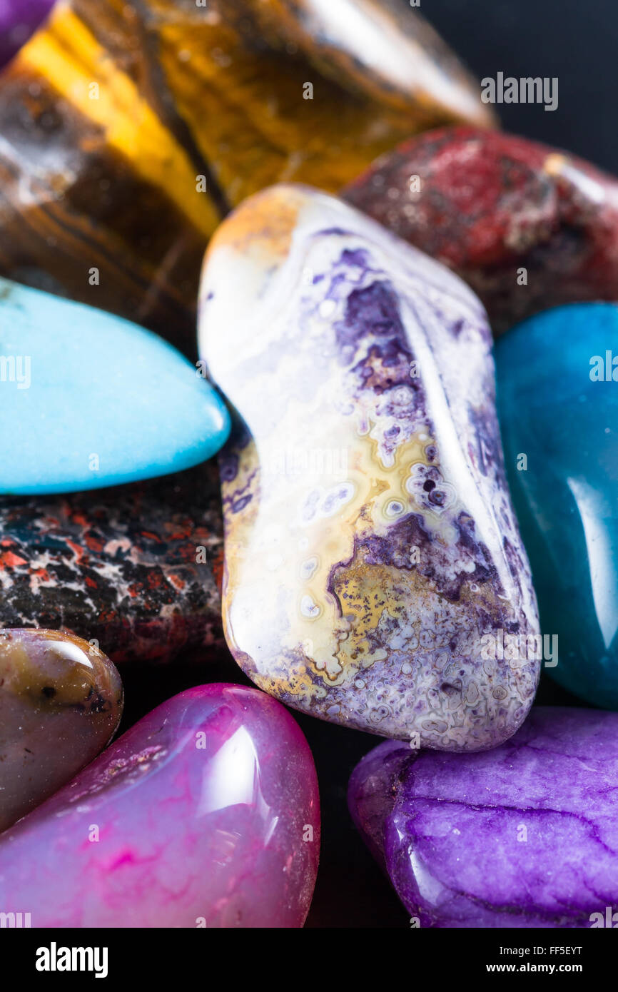 close up of a pile of polished stones in multiple colors and shapes ...