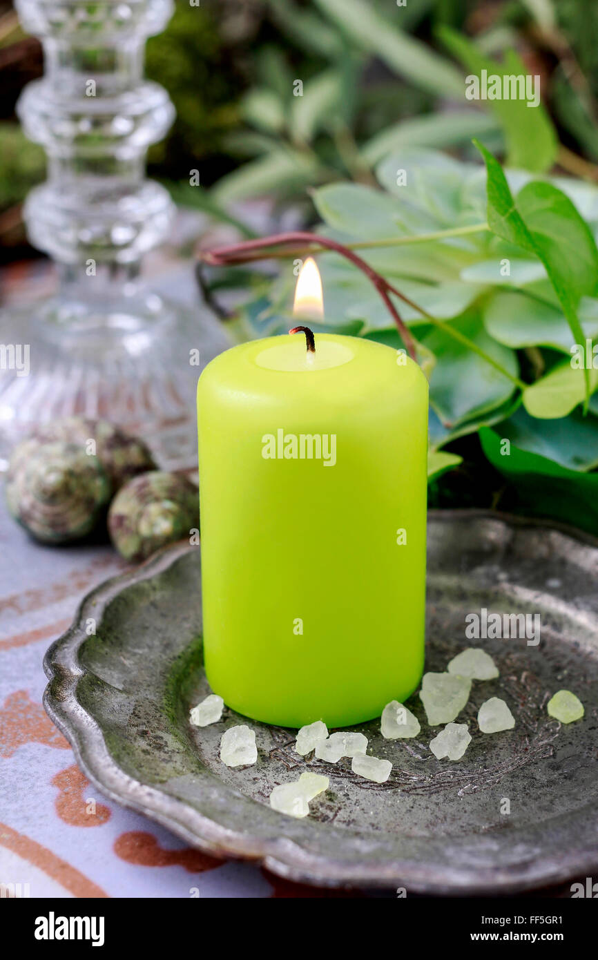 Single green candle Stock Photo - Alamy