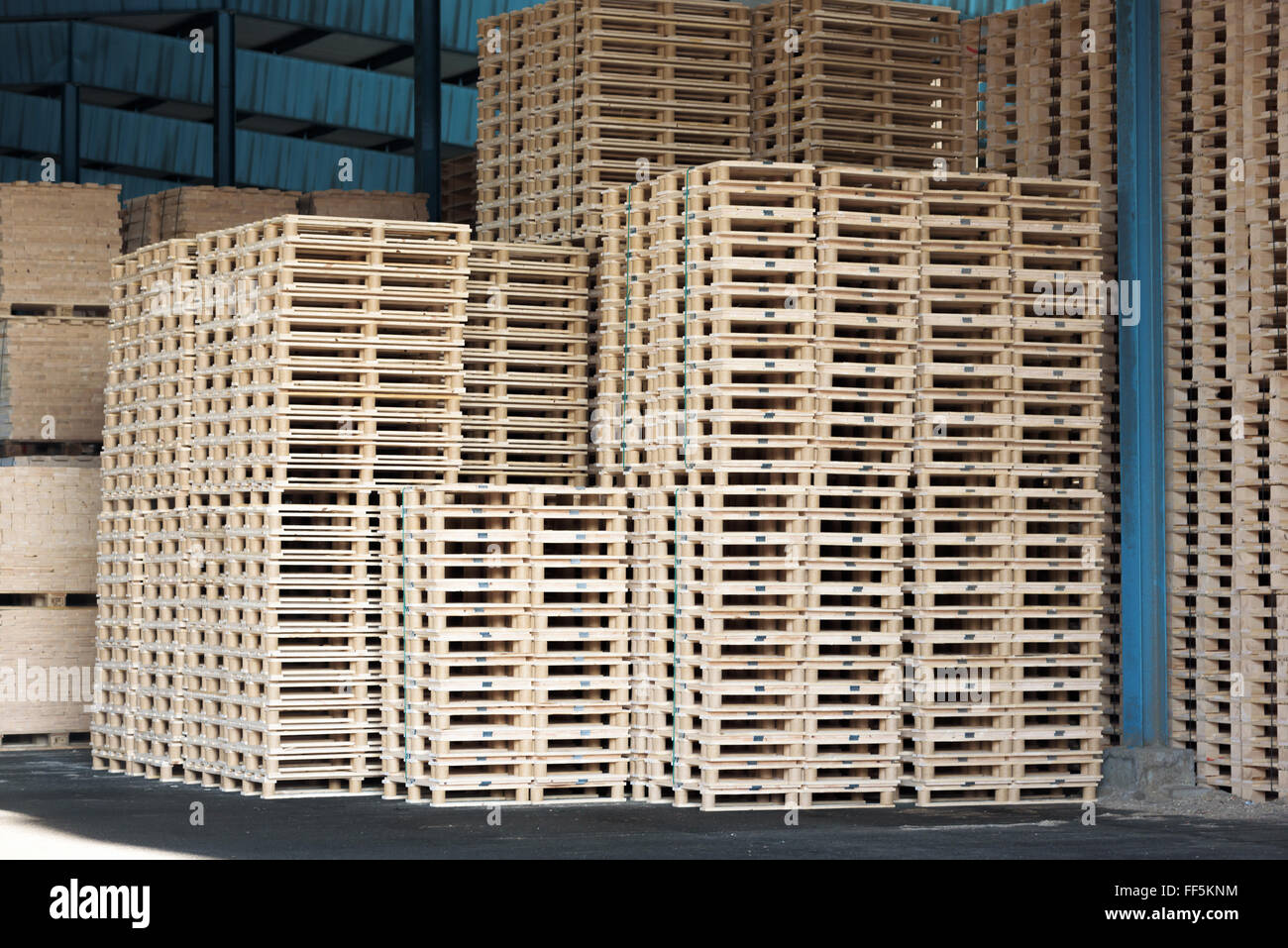 Lots of pallets stacked and ready for use. These are newly manufactured ...