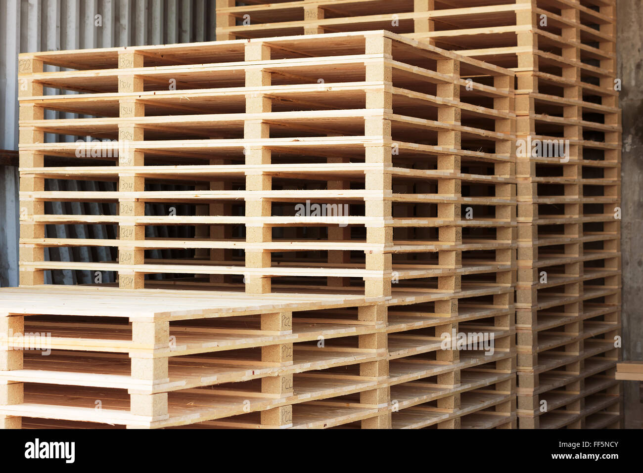 Lots of pallets stacked and ready for use. These are newly manufactured ...