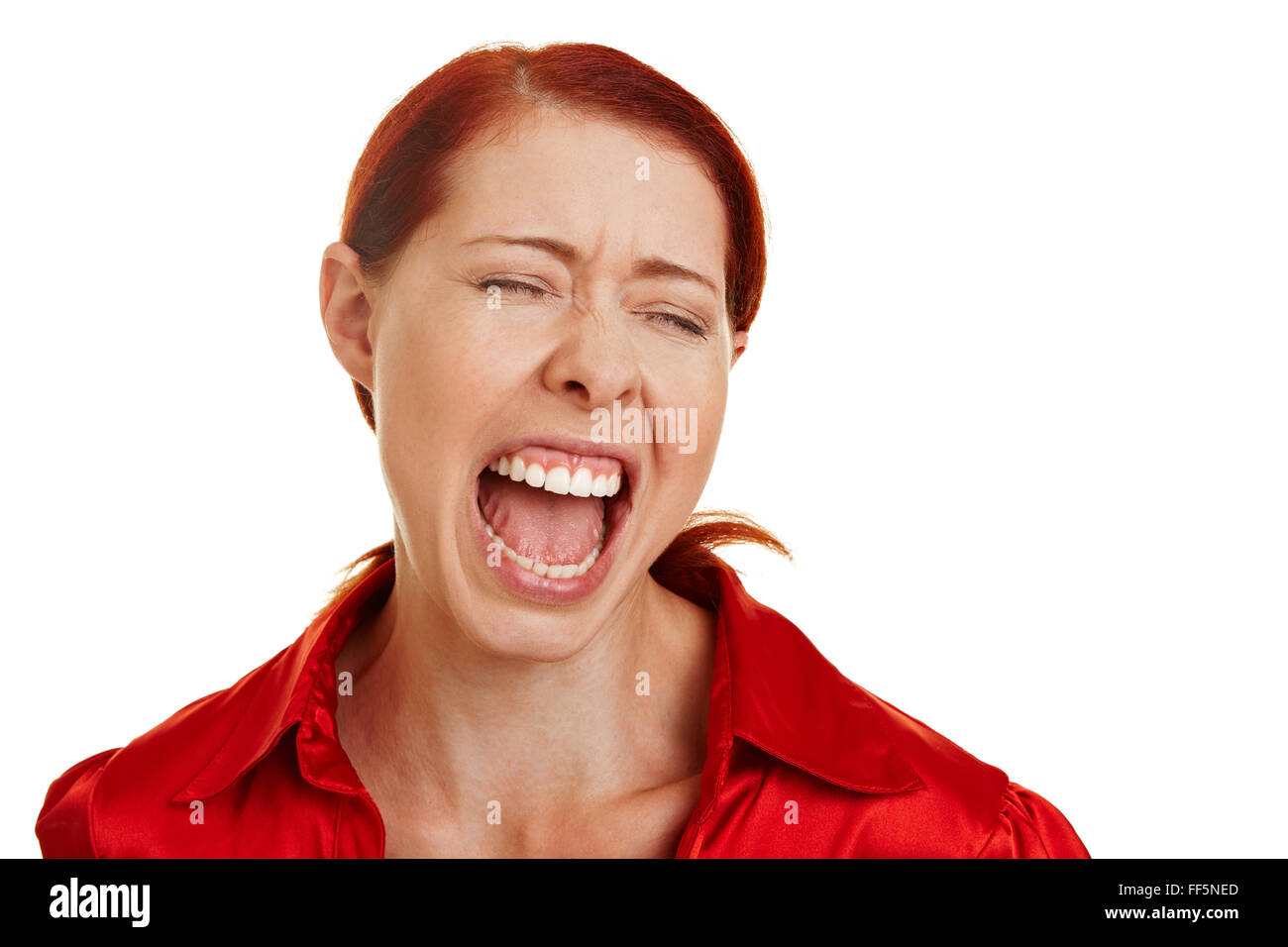 Frustrated redhaired woman screaming loudly with open mouth Stock Photo ...