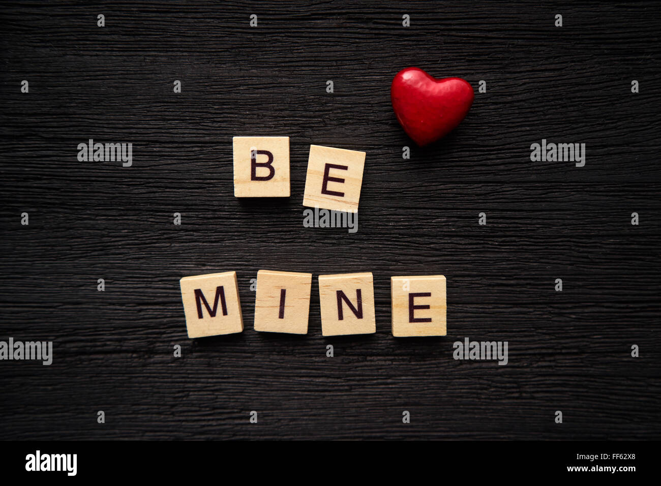 Wooden letters spelling be mine Stock Photo - Alamy