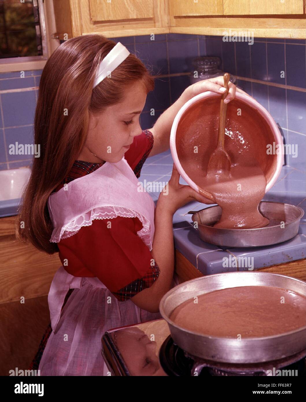1960s girl cooking hi-res stock photography and images - Alamy